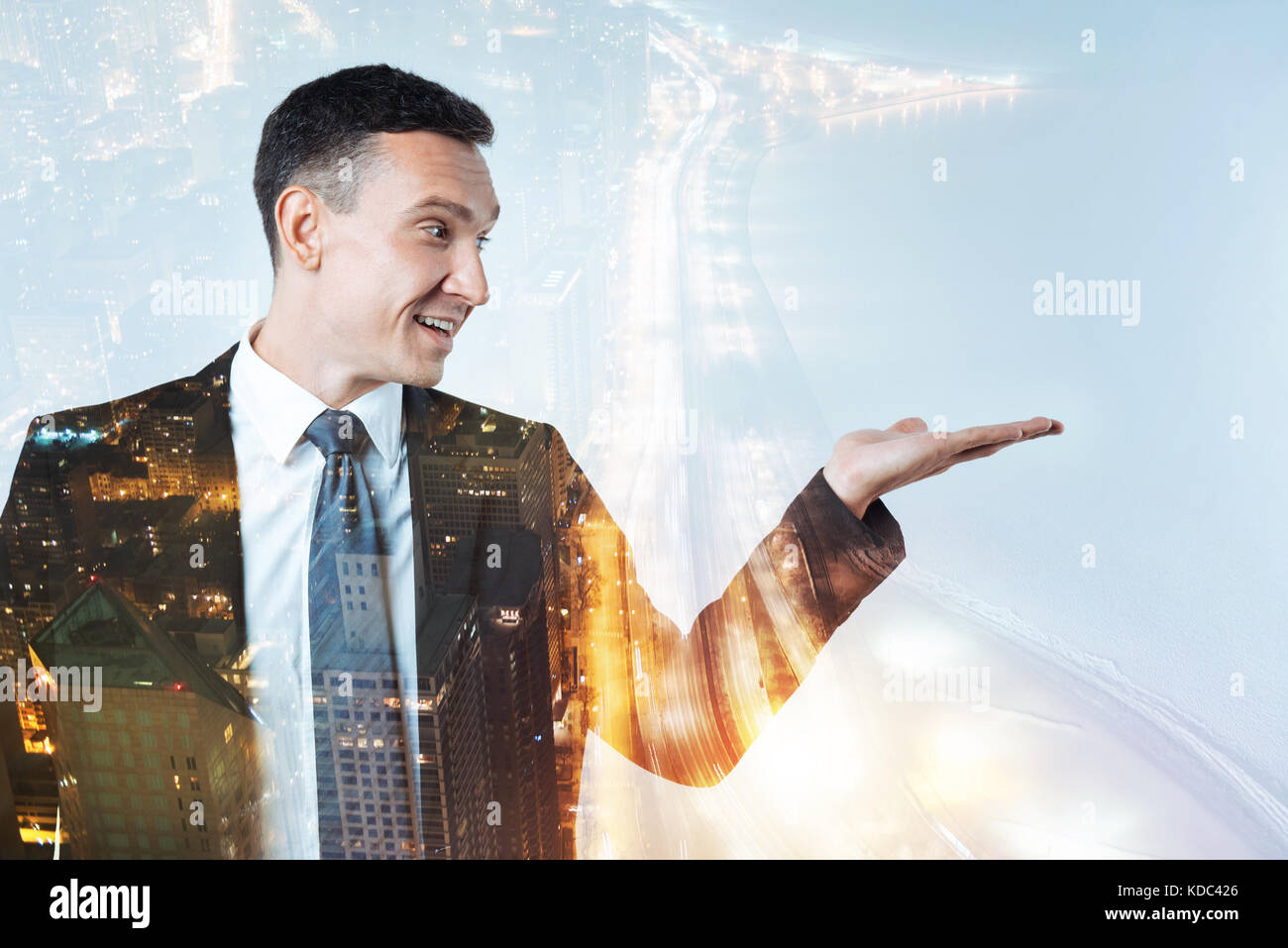 Cheerful businessman showing perspectives of his company Stock Photo ...