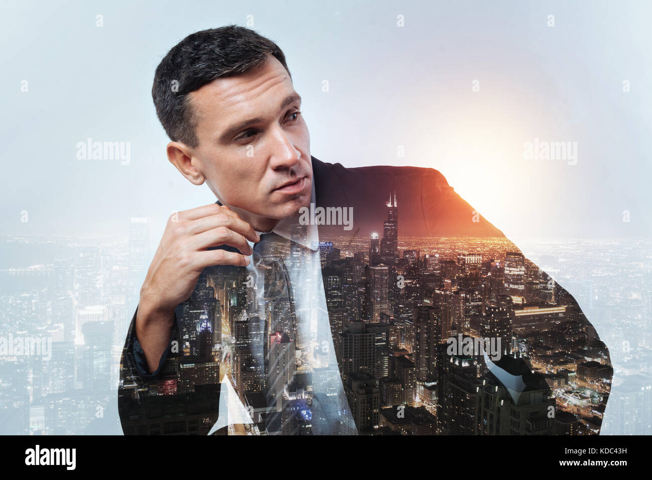 Tired elegant man looking behind his back Stock Photo - Alamy