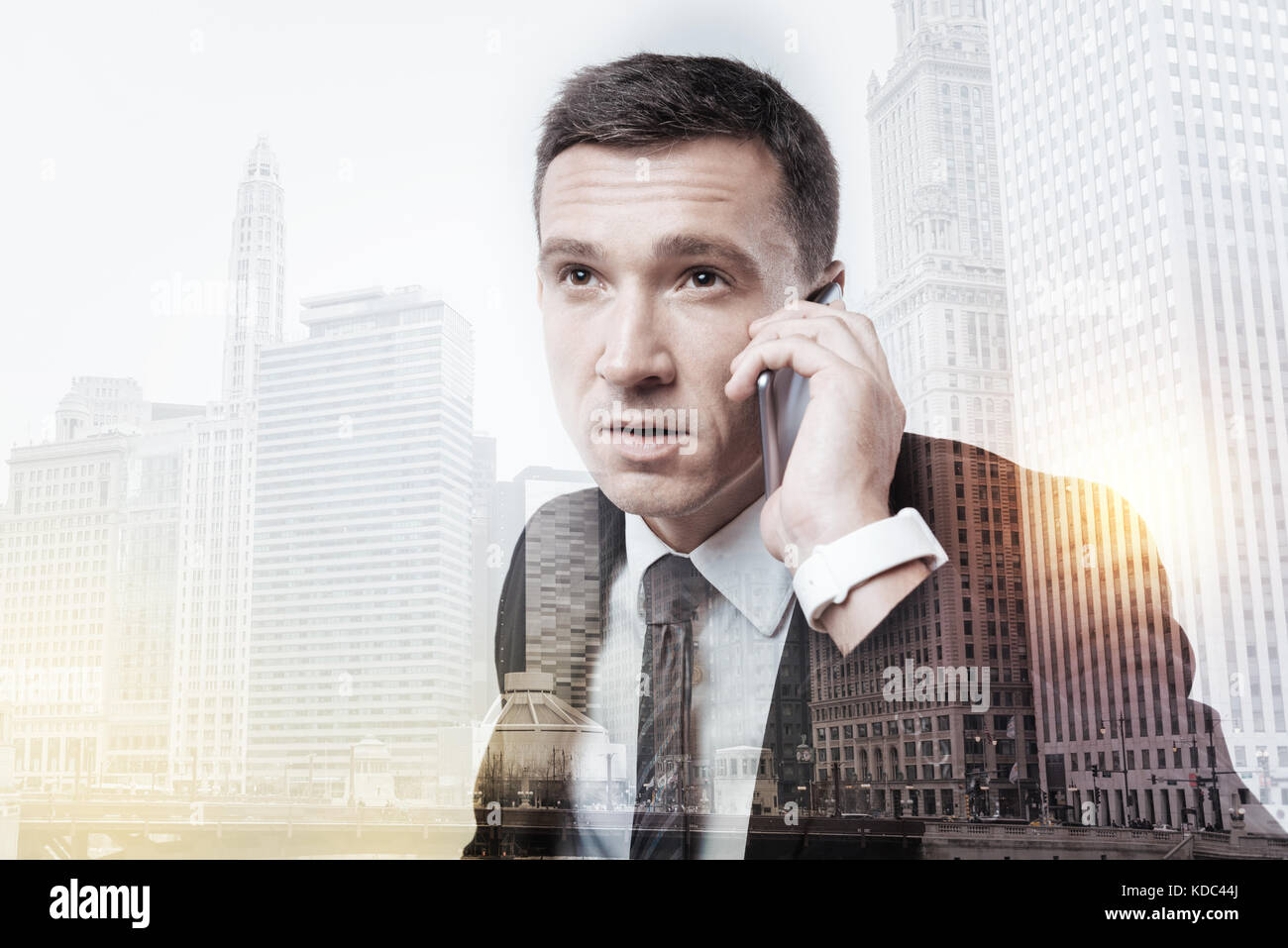 Serious busy man talking on the phone Stock Photo - Alamy Serious busy man talking on the phone Stock Photo - Alamy