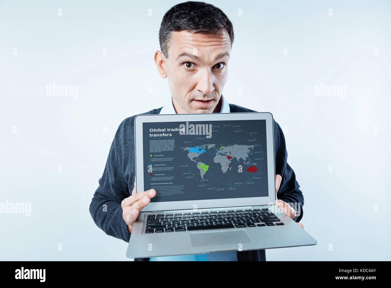 Responsible worker showing important information on his laptop Stock ...
