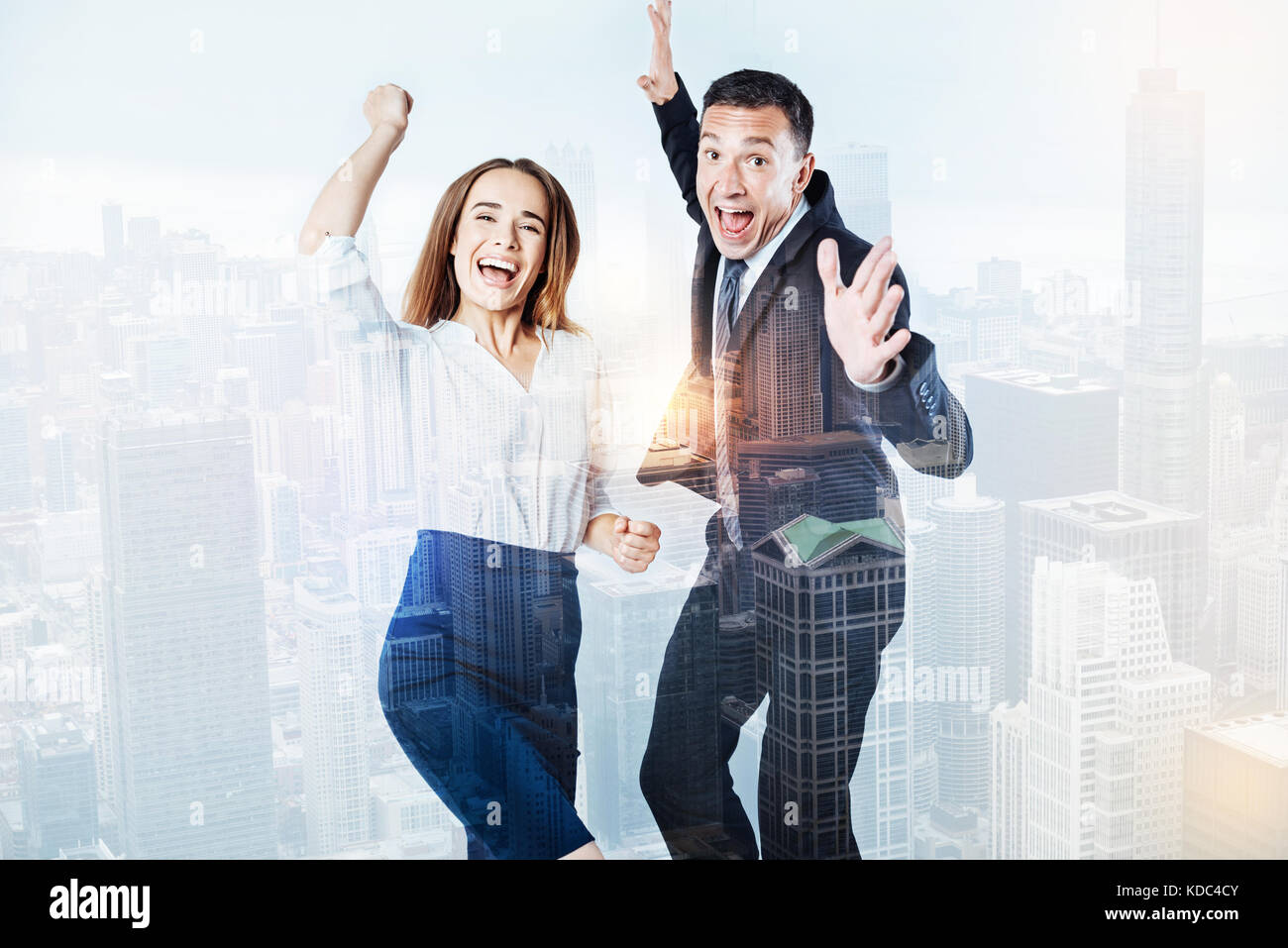 Jumping colleagues celebrating their victory Stock Photo - Alamy