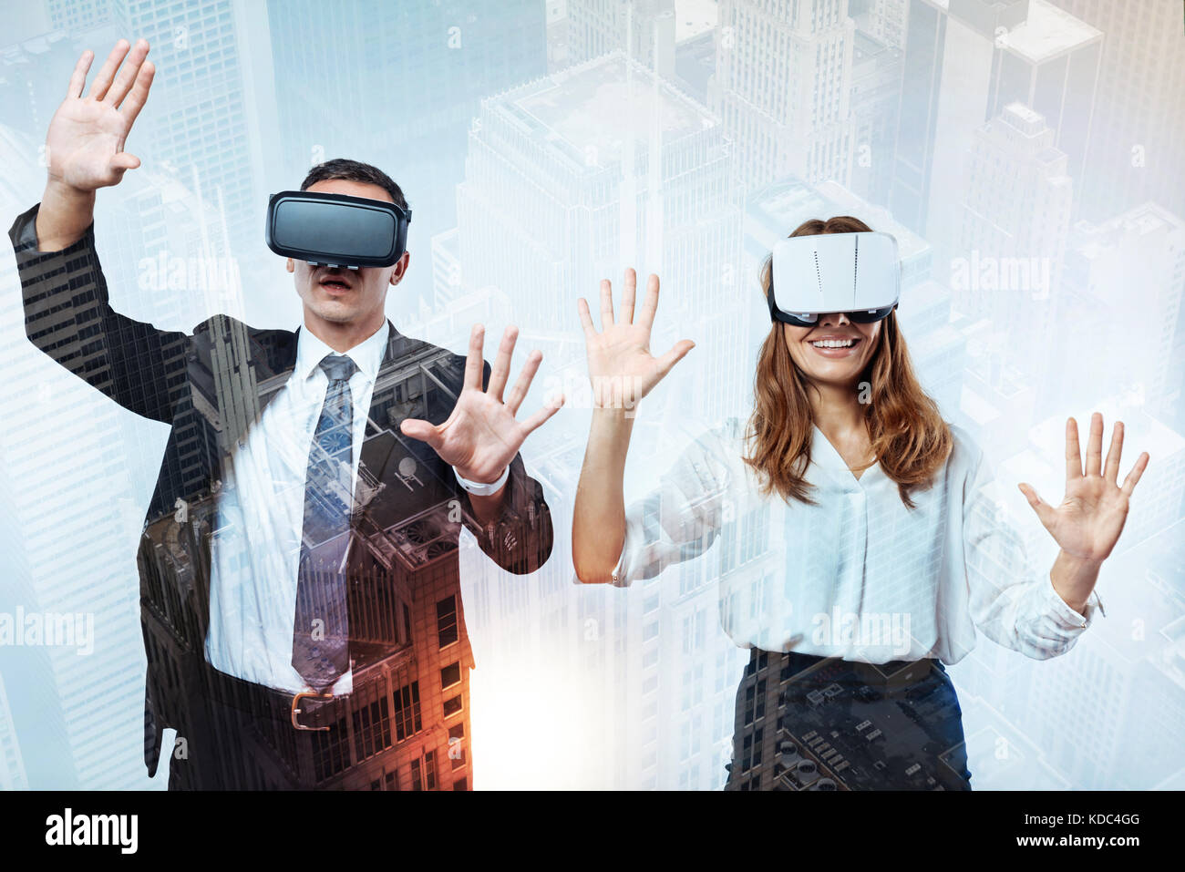 Young people having fun with virtual reality device Stock Photo - Alamy