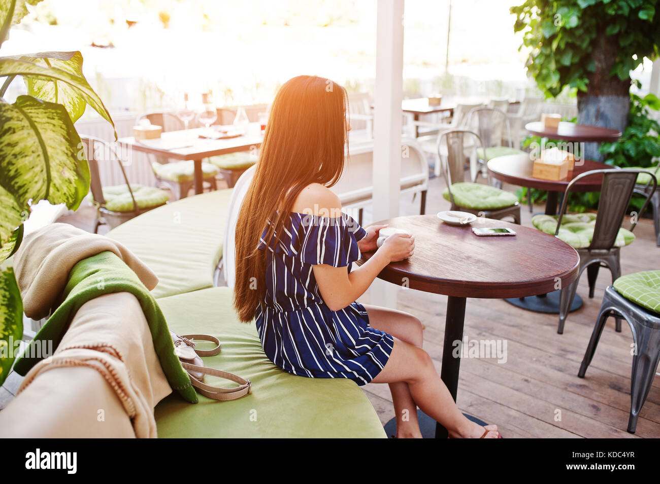 Cute girl sitting cafe shopping hi-res stock photography and images - Alamy
