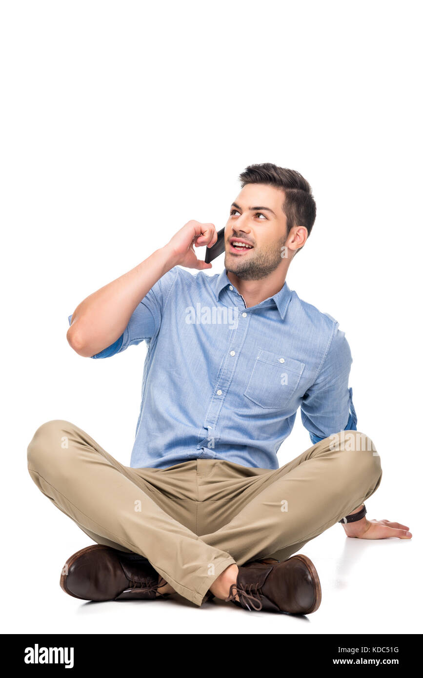 Young businessman sitting talking Cut Out Stock Images & Pictures - Alamy