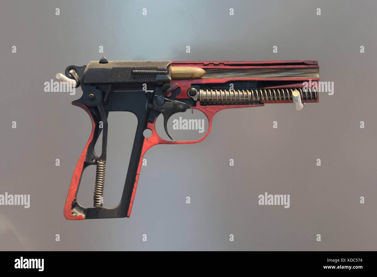 Used black metal 9mm pistol gun on solid background - Half gun Stock ...