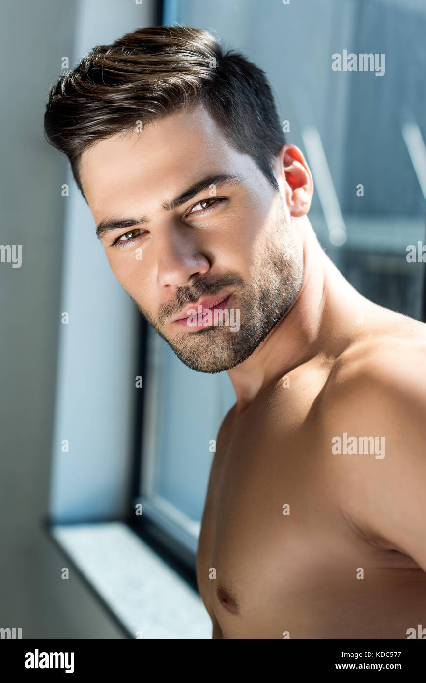 man standing at window Stock Photo - Alamy
