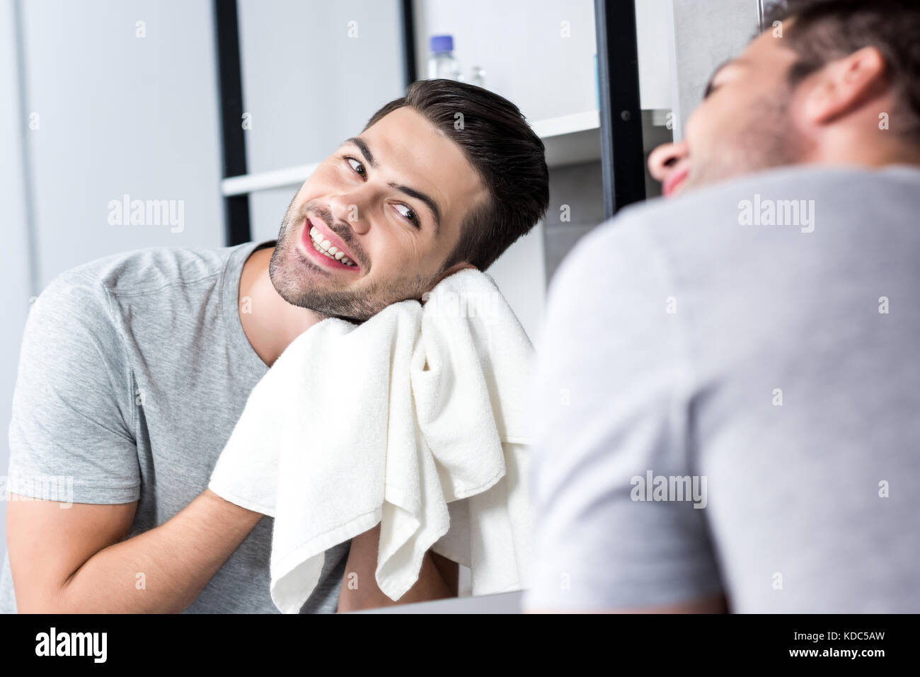 man wiping face with towel Stock Photo - Alamy
