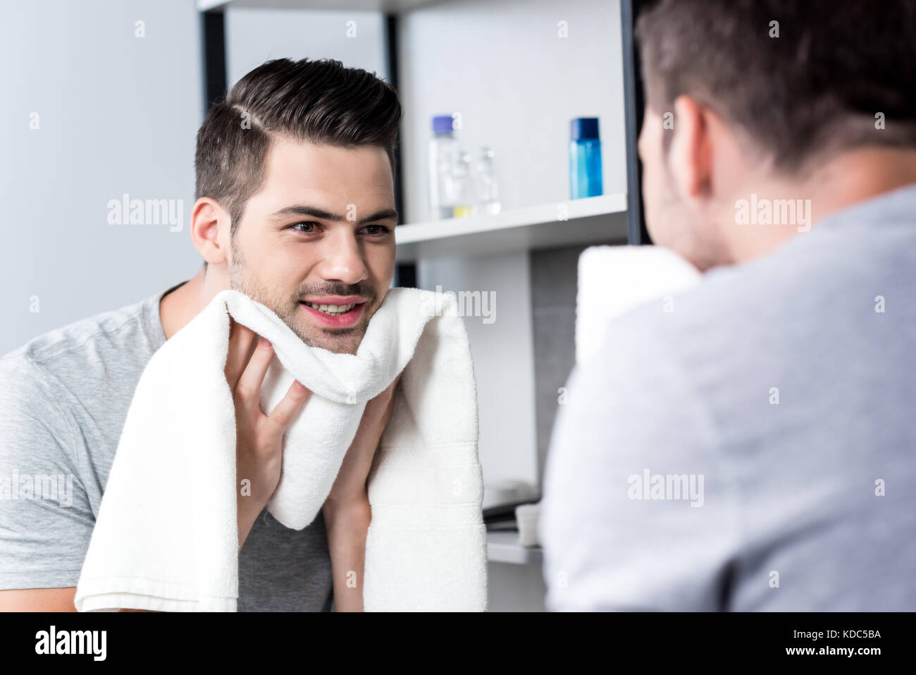 Man wiping face shirt hi-res stock photography and images - Alamy