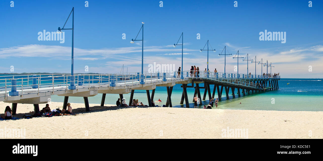 Families enjoying sandy beach on sunny day at Palm Beach Jetty ...