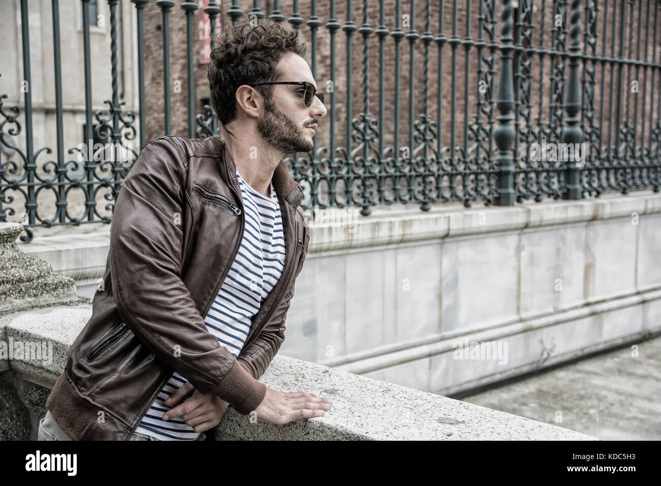 Attractive young man outdoor wearing leather jacket Stock Photo - Alamy
