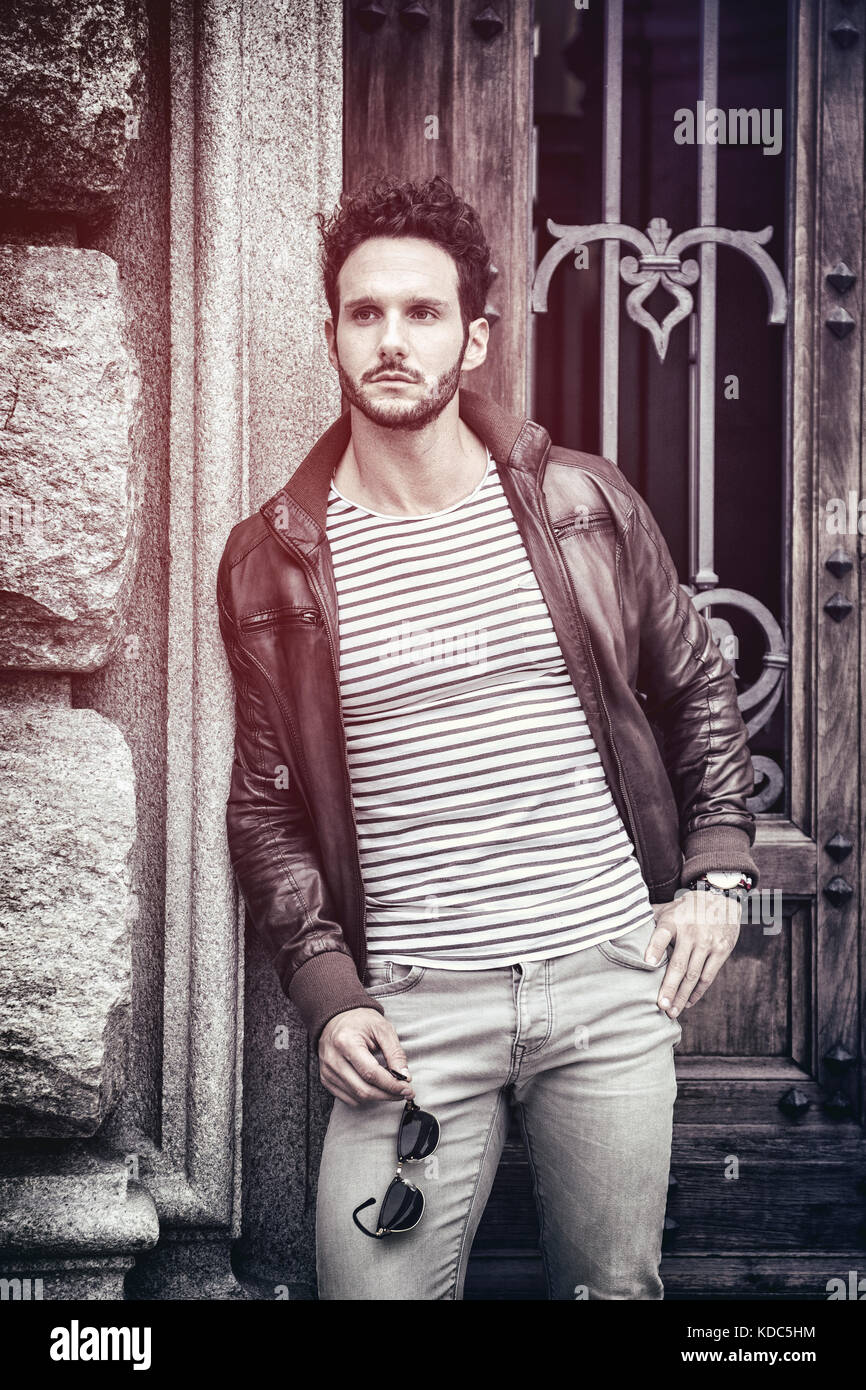 Attractive young man outdoor wearing leather jacket Stock Photo - Alamy