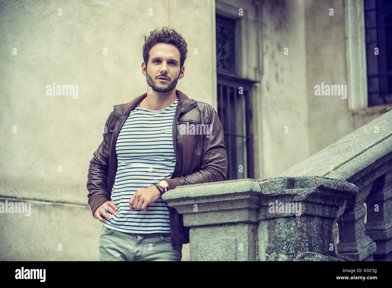 Attractive young man outdoor wearing leather jacket Stock Photo - Alamy