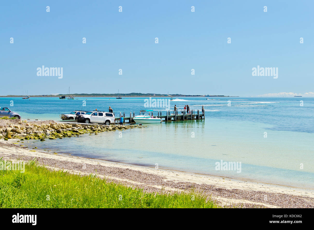 fishermen launching boats at boat ramp on sunny day Stock Photo - Alamy