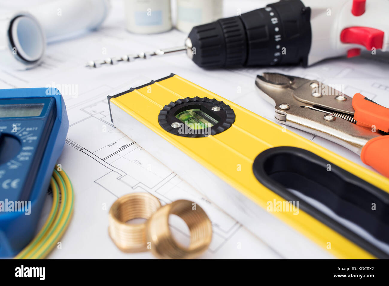Building Tools And Components Arranged On House Plans Stock Photo - Alamy