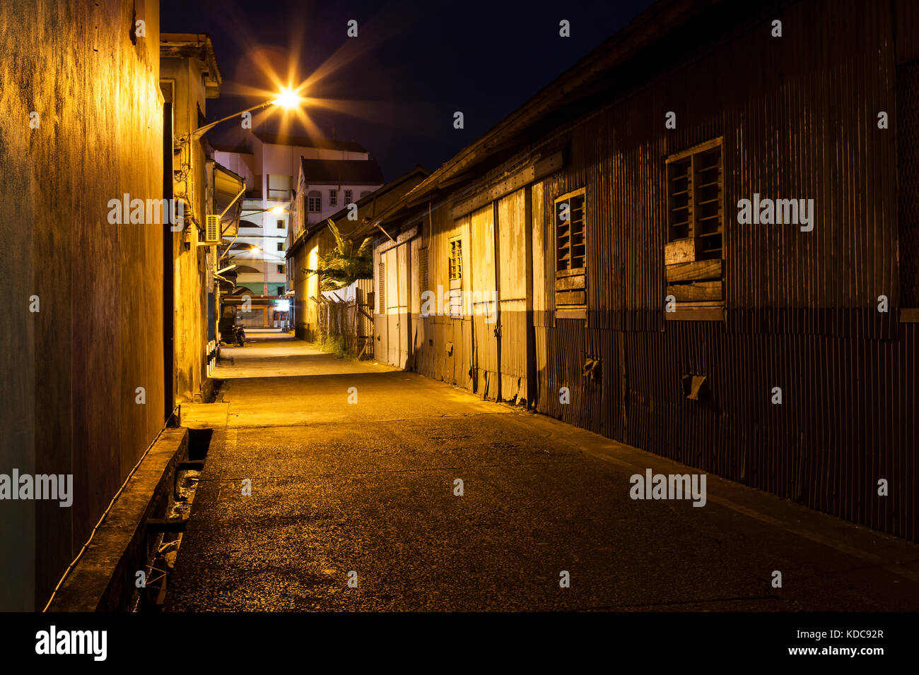 Urban city alley at night Stock Photo - Alamy