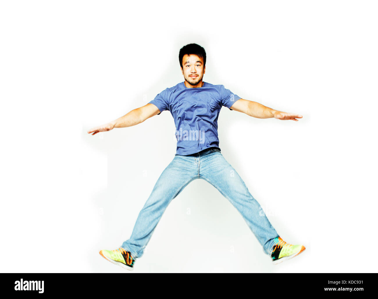 young pretty asian man jumping cheerful against white background Stock ...