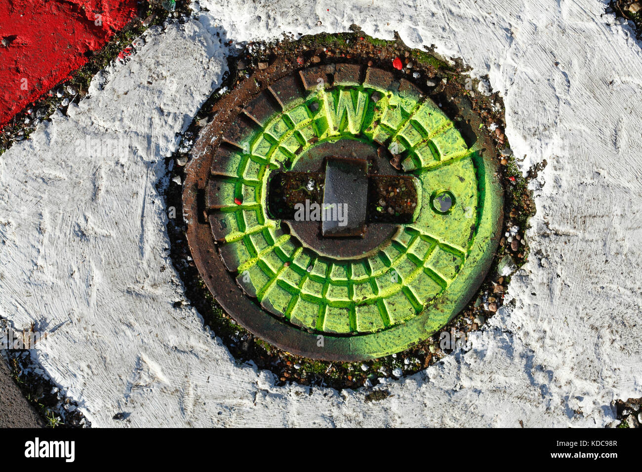 green round fire hydrant lid Stock Photo - Alamy