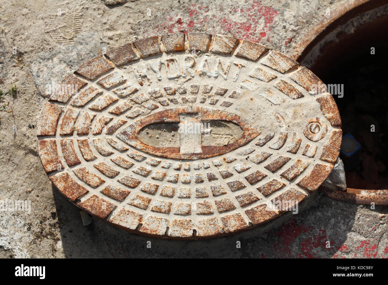 rusty fire hydrant lid Stock Photo - Alamy