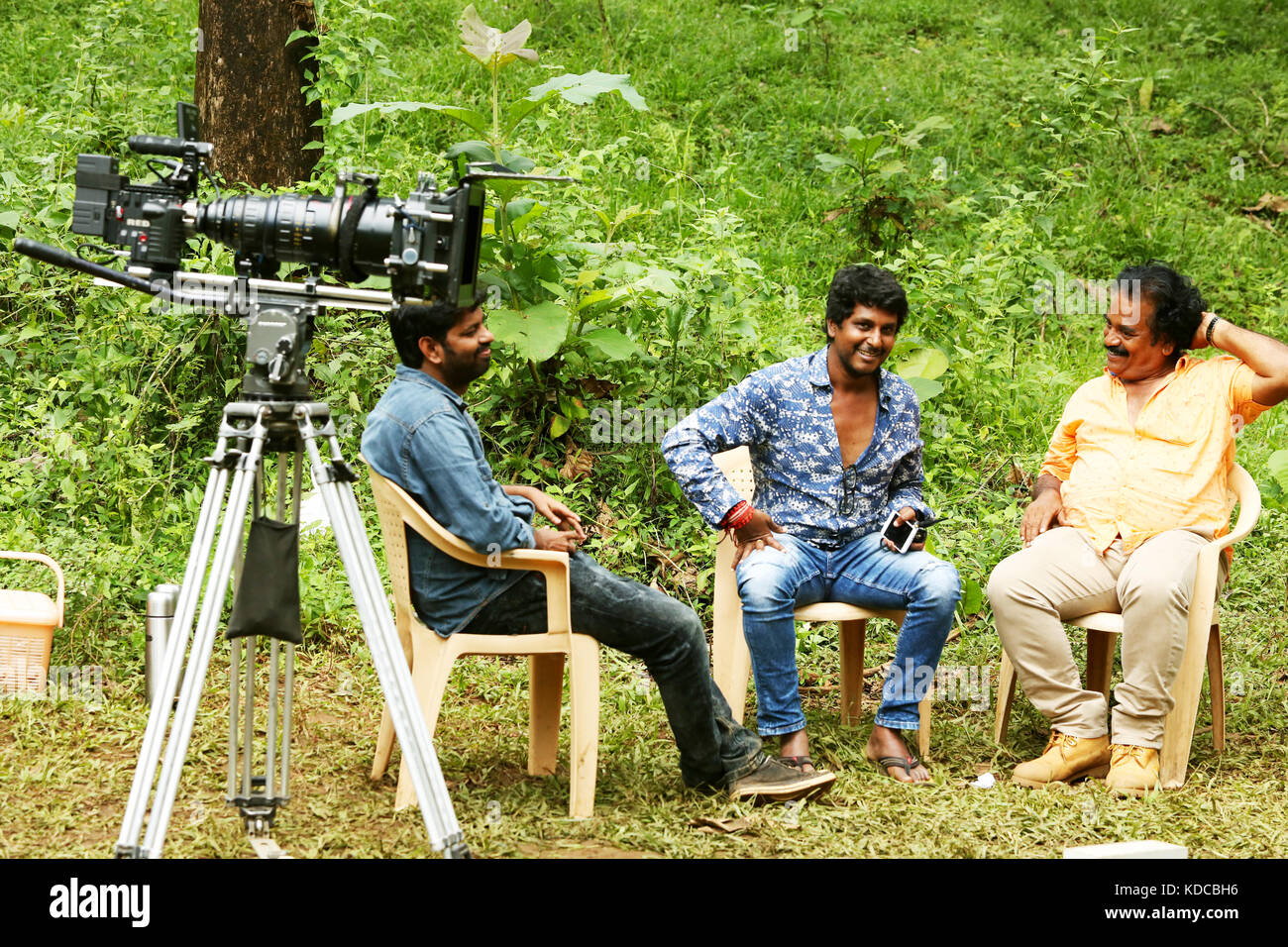 Film director, cinematographer relax on shooting spot Stock Photo - Alamy