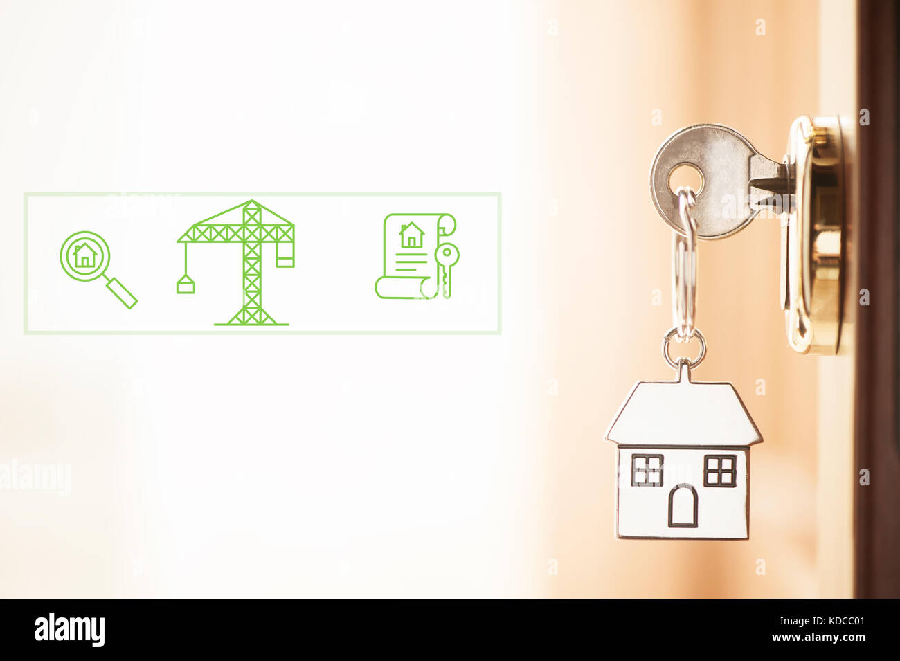 A key in a lock with house icon on it Stock Photo - Alamy