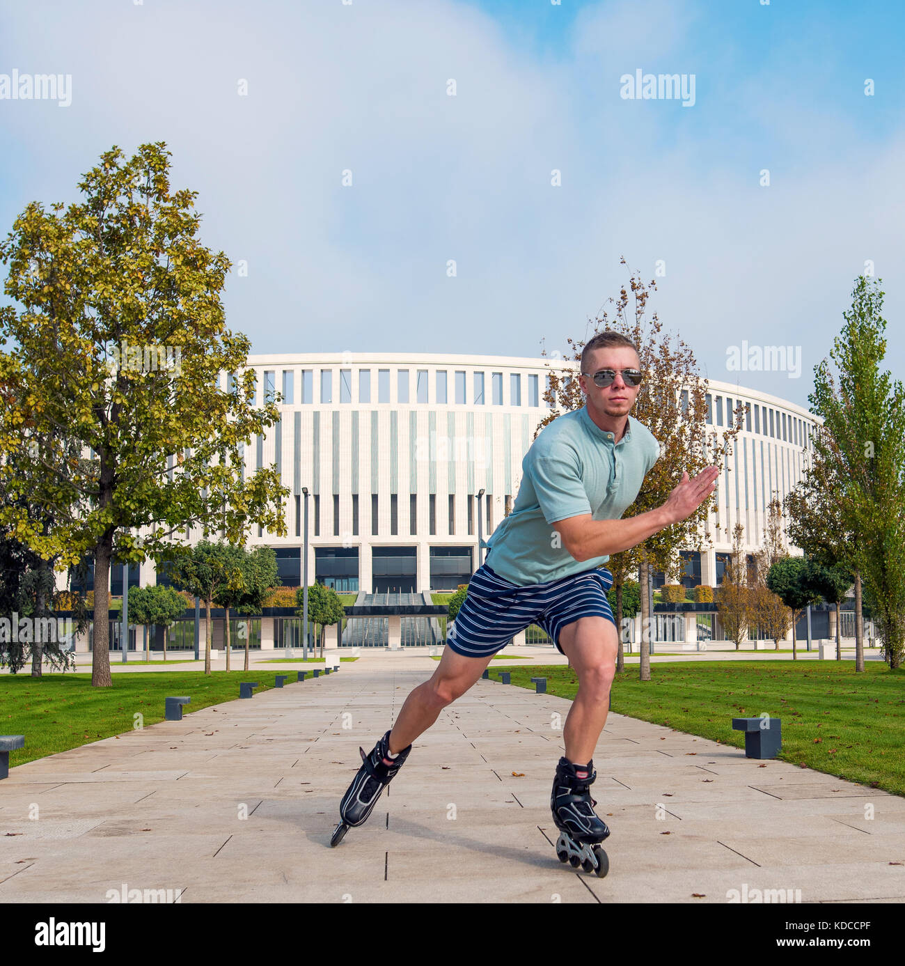 sports man rollerblading in the Park Stock Photo - Alamy
