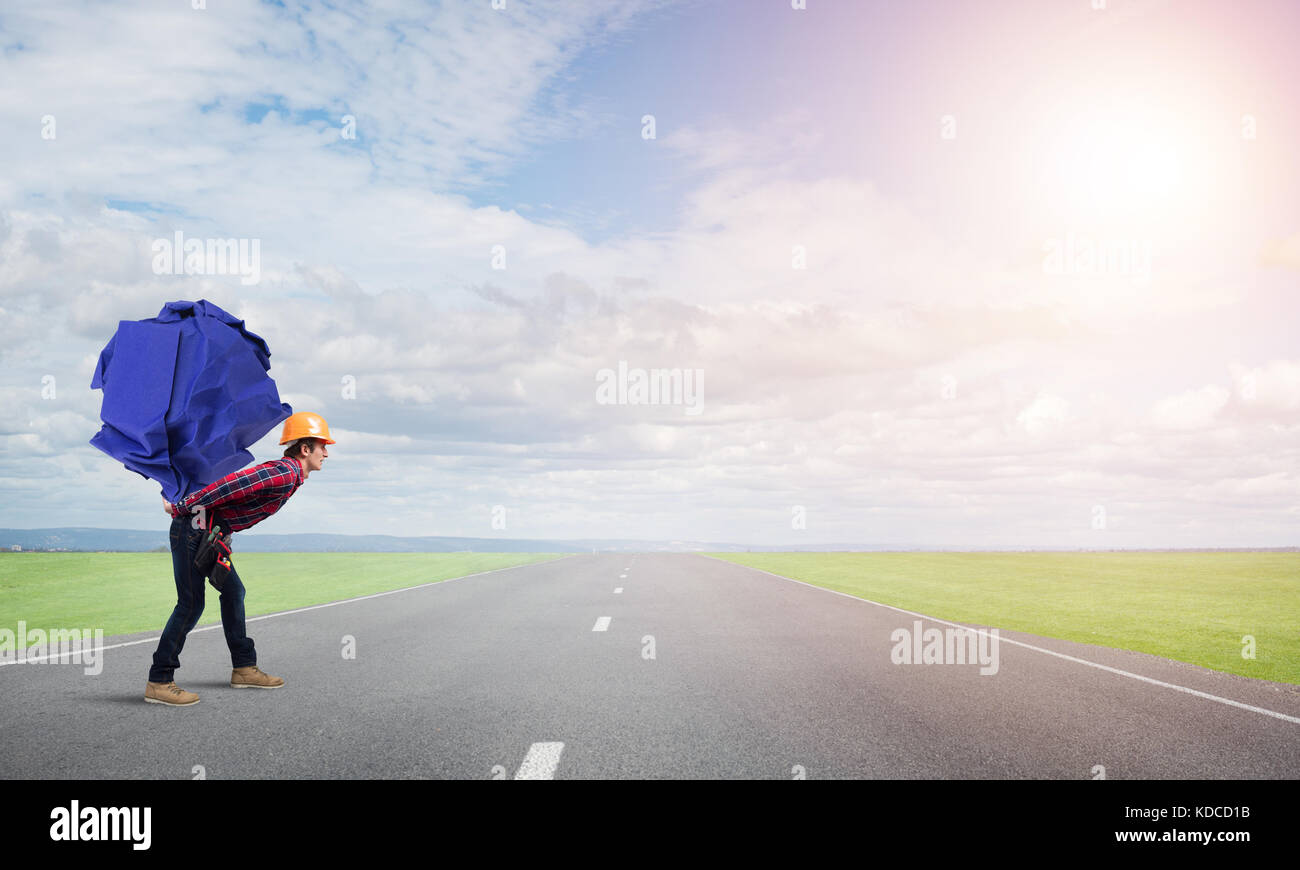Engineer man carry load Stock Photo - Alamy