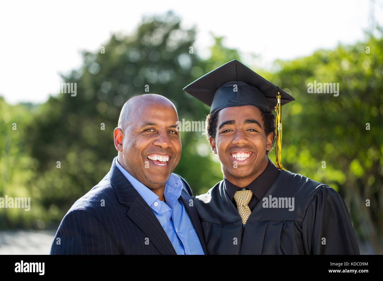 Father hugging his son on his graduation day Stock Photo - Alamy