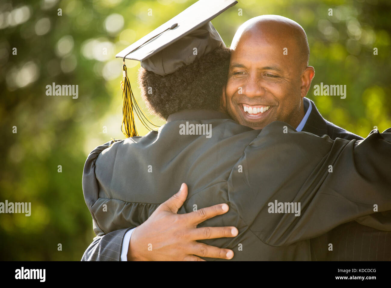 Father hugging his son on his graduation day Stock Photo - Alamy