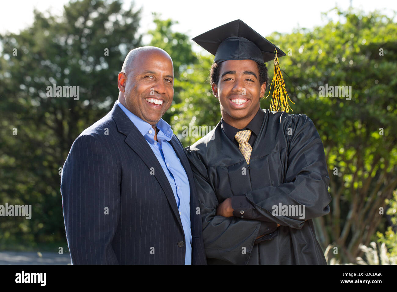 Father hugging his son on his graduation day Stock Photo - Alamy