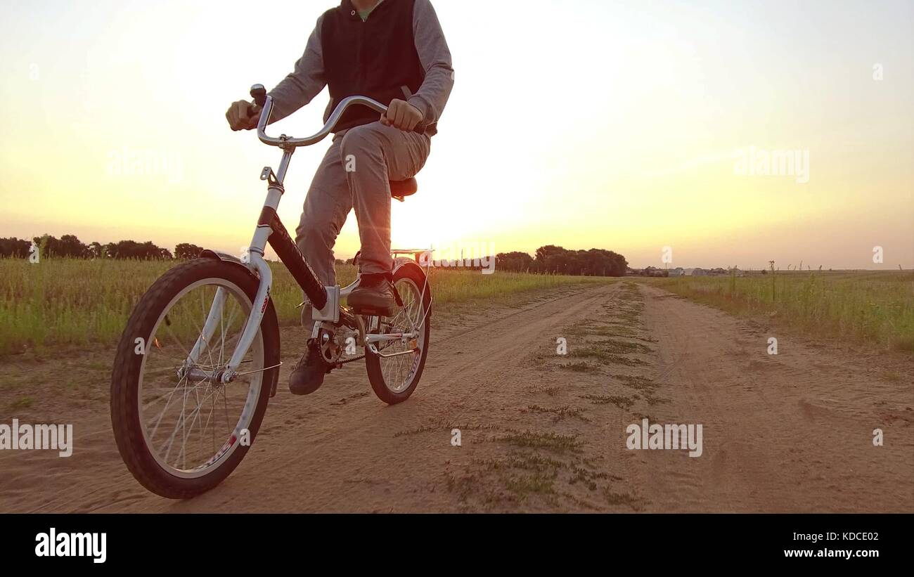 Boy teenager riding a bicycle. Boy teenager riding a bicycle goes to ...
