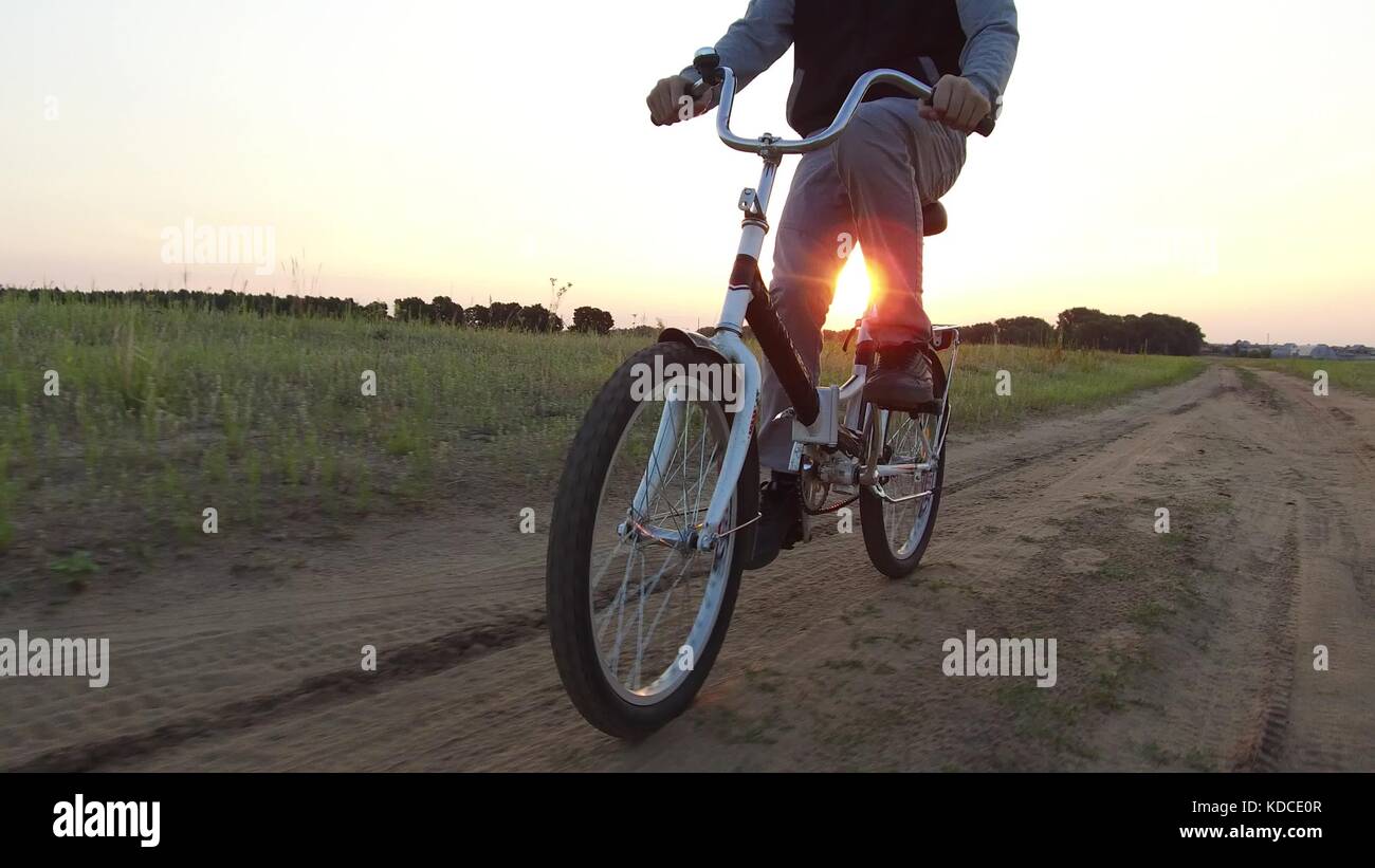 Boy teenager riding a bicycle. Boy teenager riding bicycle goes to ...