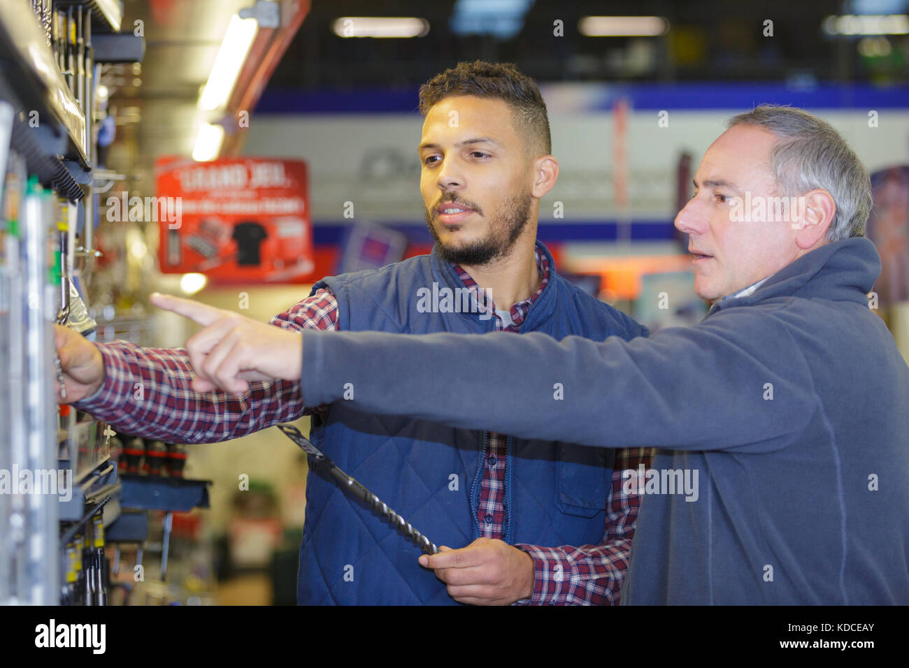 workers checking machine Stock Photo - Alamy