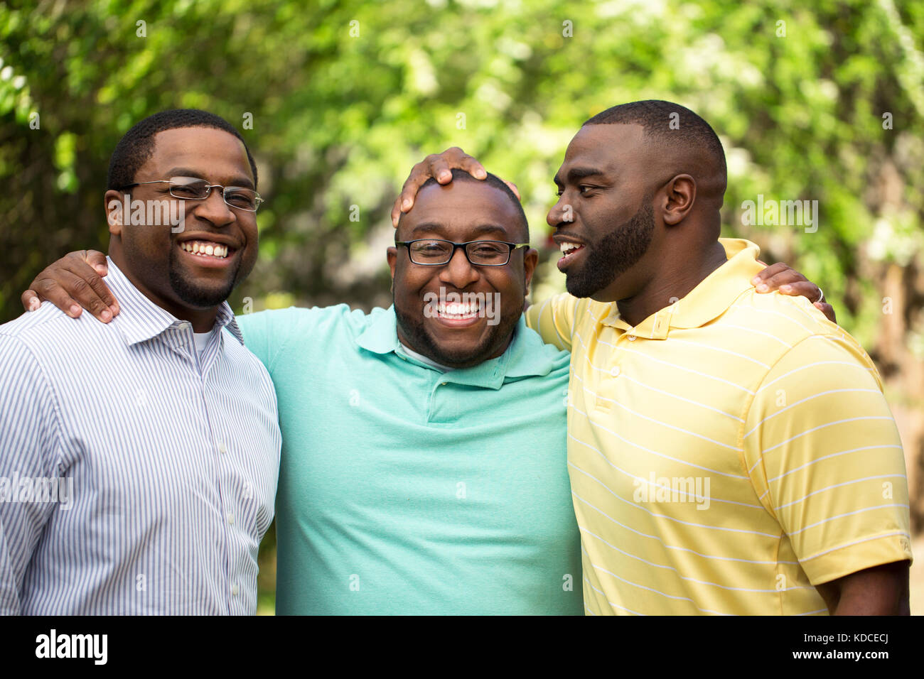 Three African American Brothers laughing and talking Stock Photo - Alamy