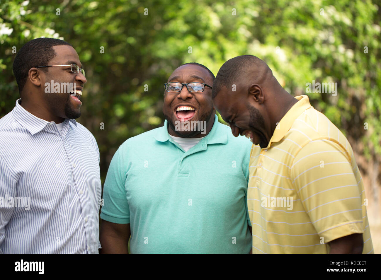 Brothers laughing and talking Stock Photo - Alamy