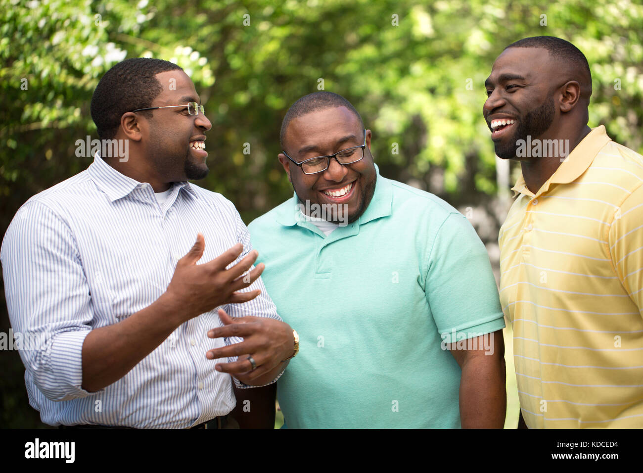 Brothers laughing and talking Stock Photo - Alamy