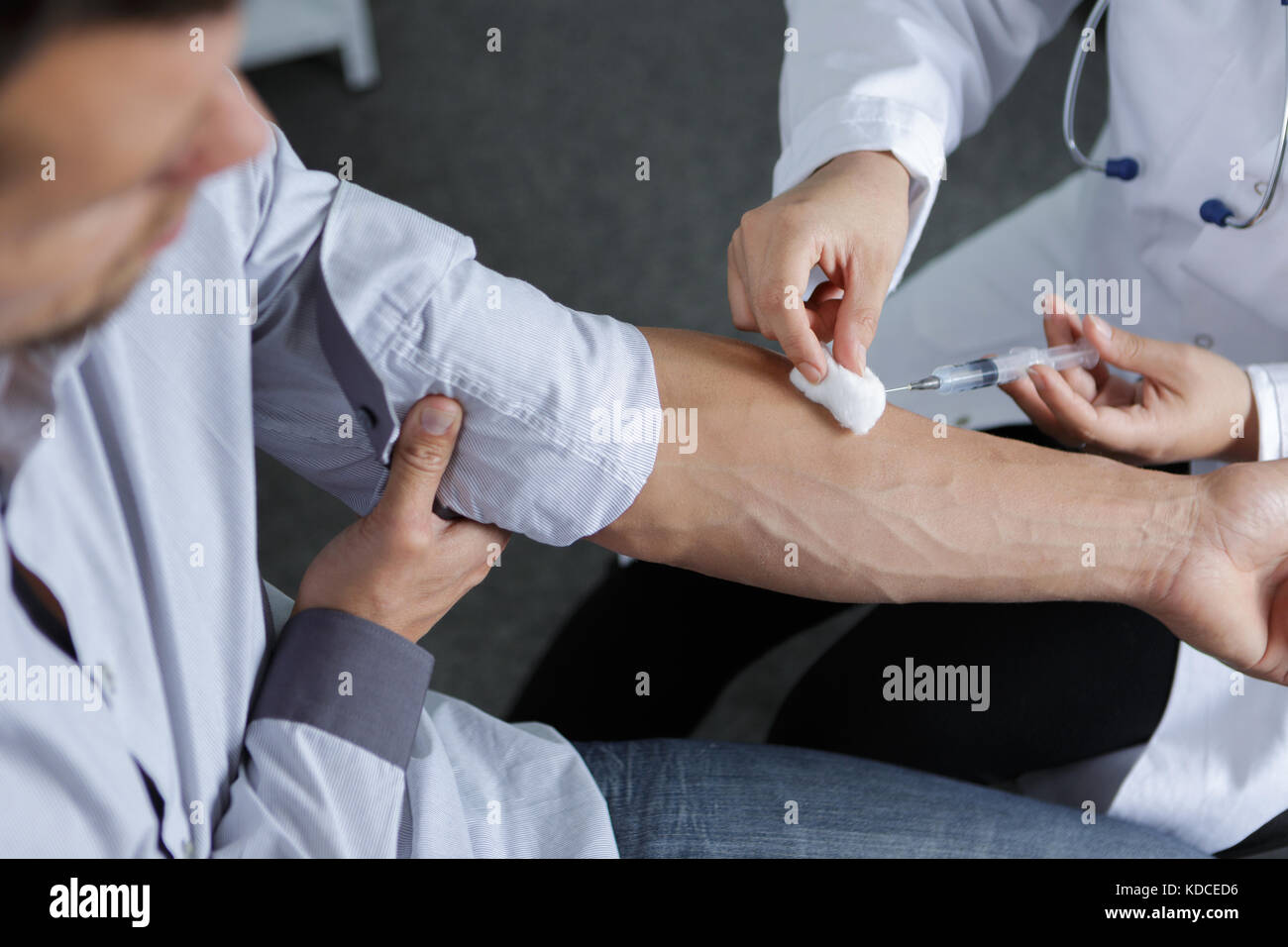 close-up of doctor injecting patient with syringe Stock Photo - Alamy