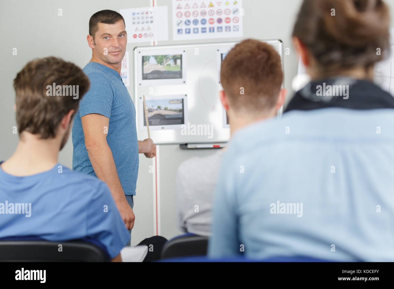 driving instructor and student drivers in a class Stock Photo - Alamy