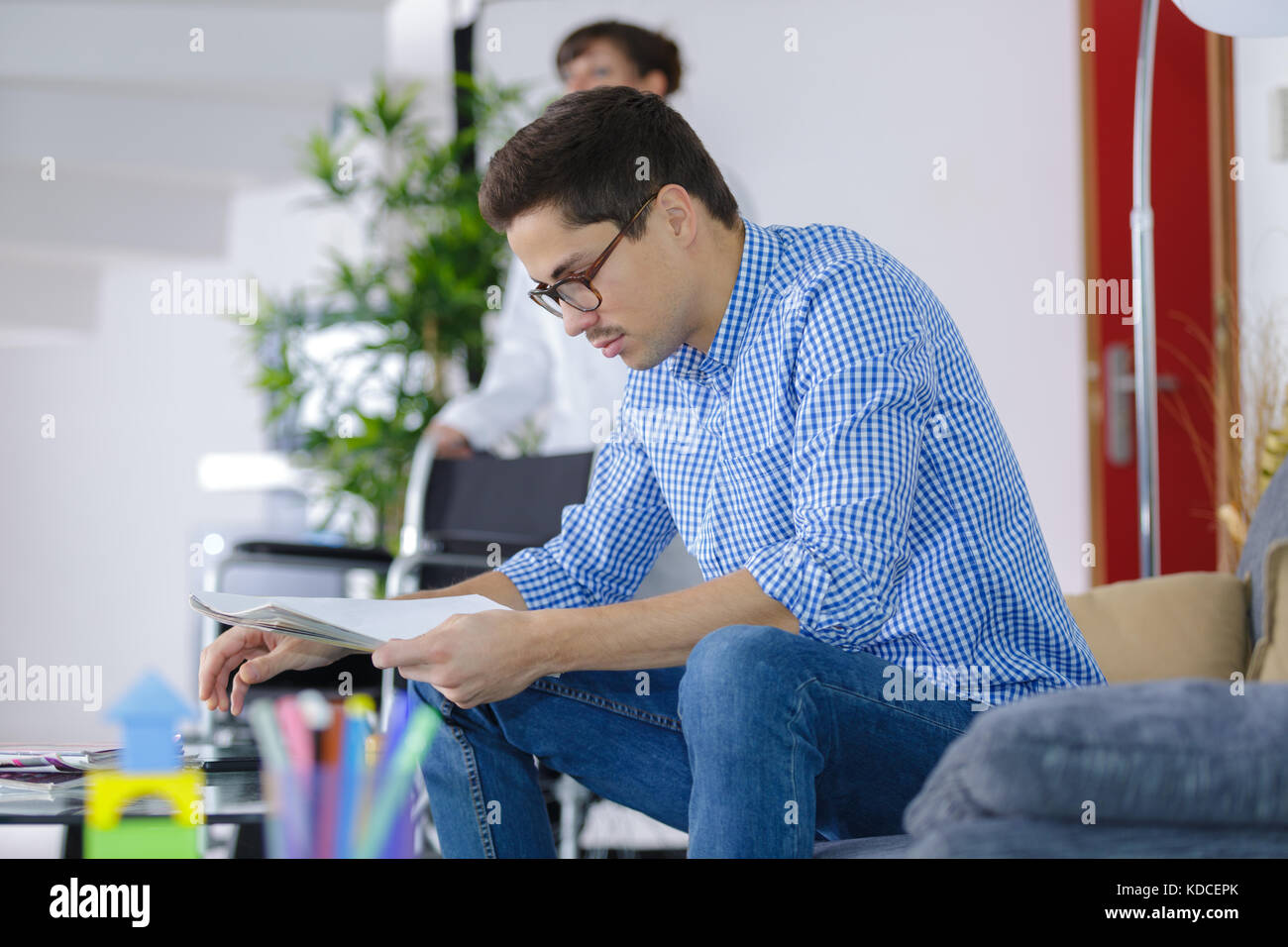 man sitting and waiting Stock Photo - Alamy