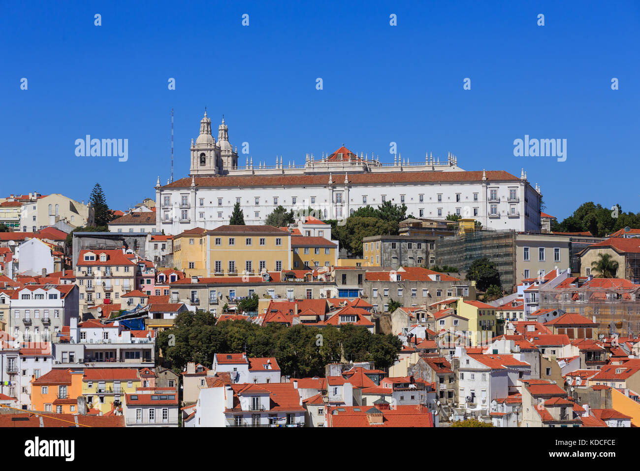 Colorful buildings and red tile rooftops on hills of Lisbon Portugal ...