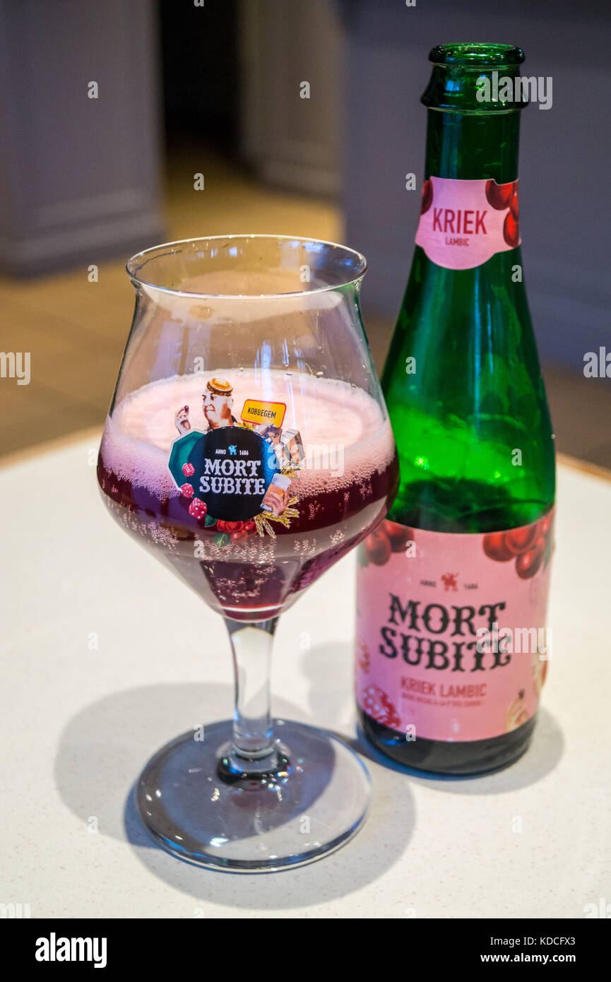 A glass and bottle of Mort Subite Kriek Belgian fruit beer, Bergues ...