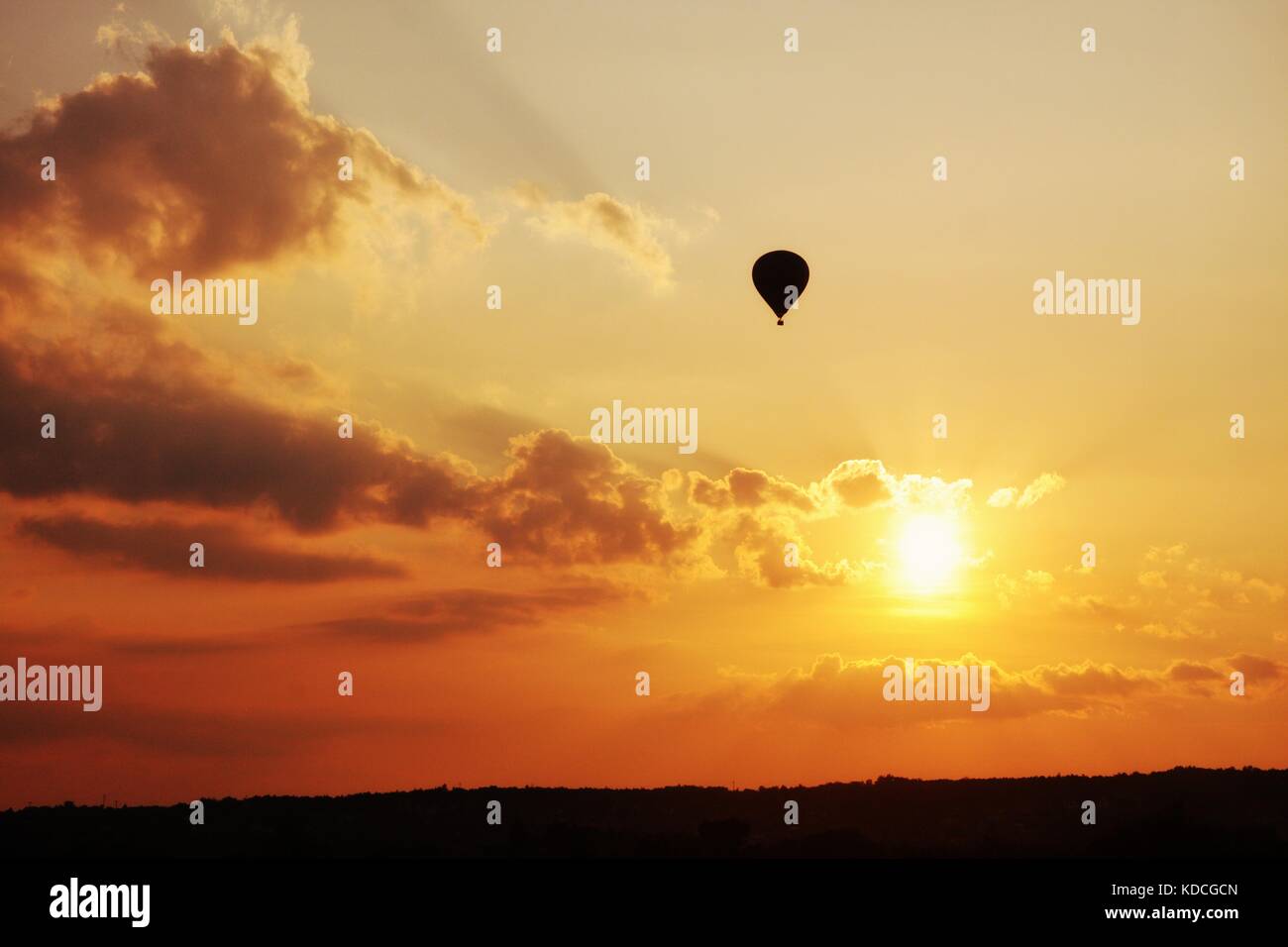 Beautiful sunset time with a balloon on the sky Stock Photo - Alamy