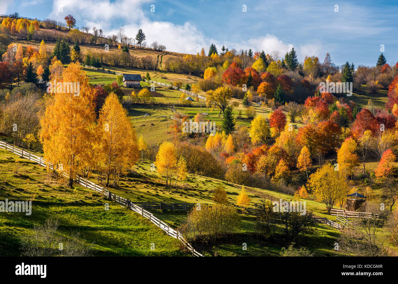 rural area on hillside in autumn. spectacular countryside scenery with ...