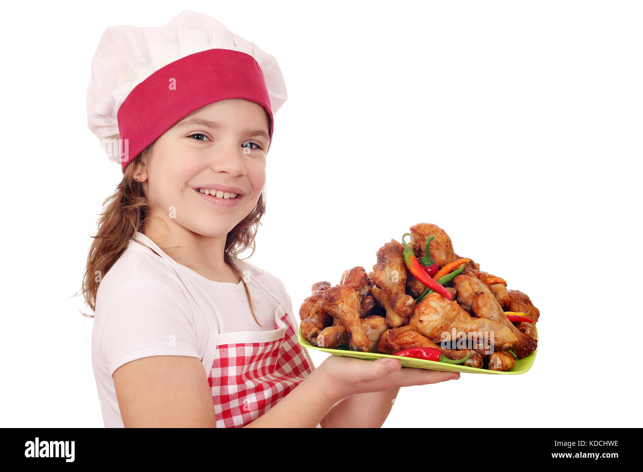 happy little girl cook with chicken drumstick Stock Photo - Alamy