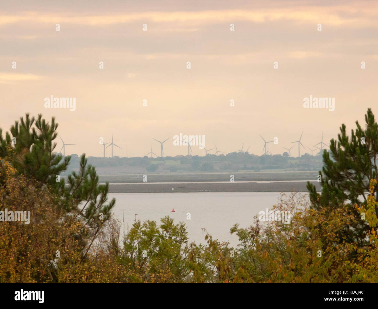 far off horizon over coast water sea with wind turbine silhouettes ...