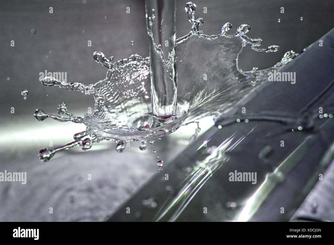 Knife Slicing Through Water Splash Stock Photo - Alamy