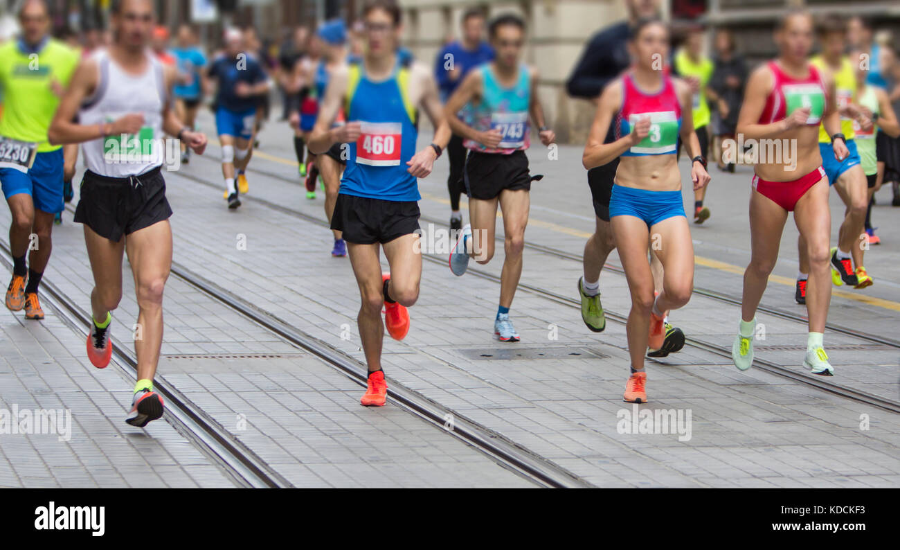 Marathon runners on city road hi-res stock photography and images - Alamy