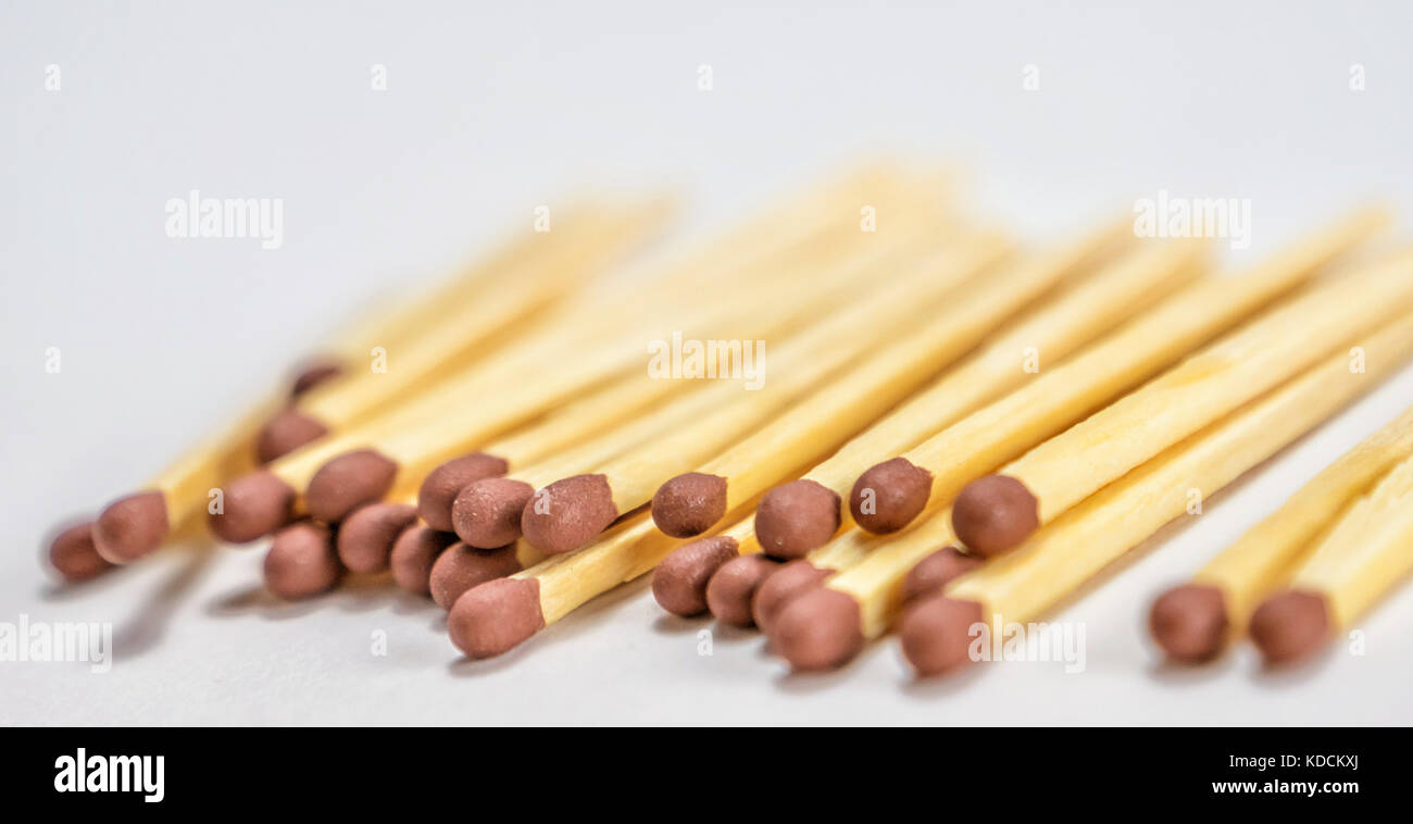 Some matches stacked isolated on white background Stock Photo - Alamy