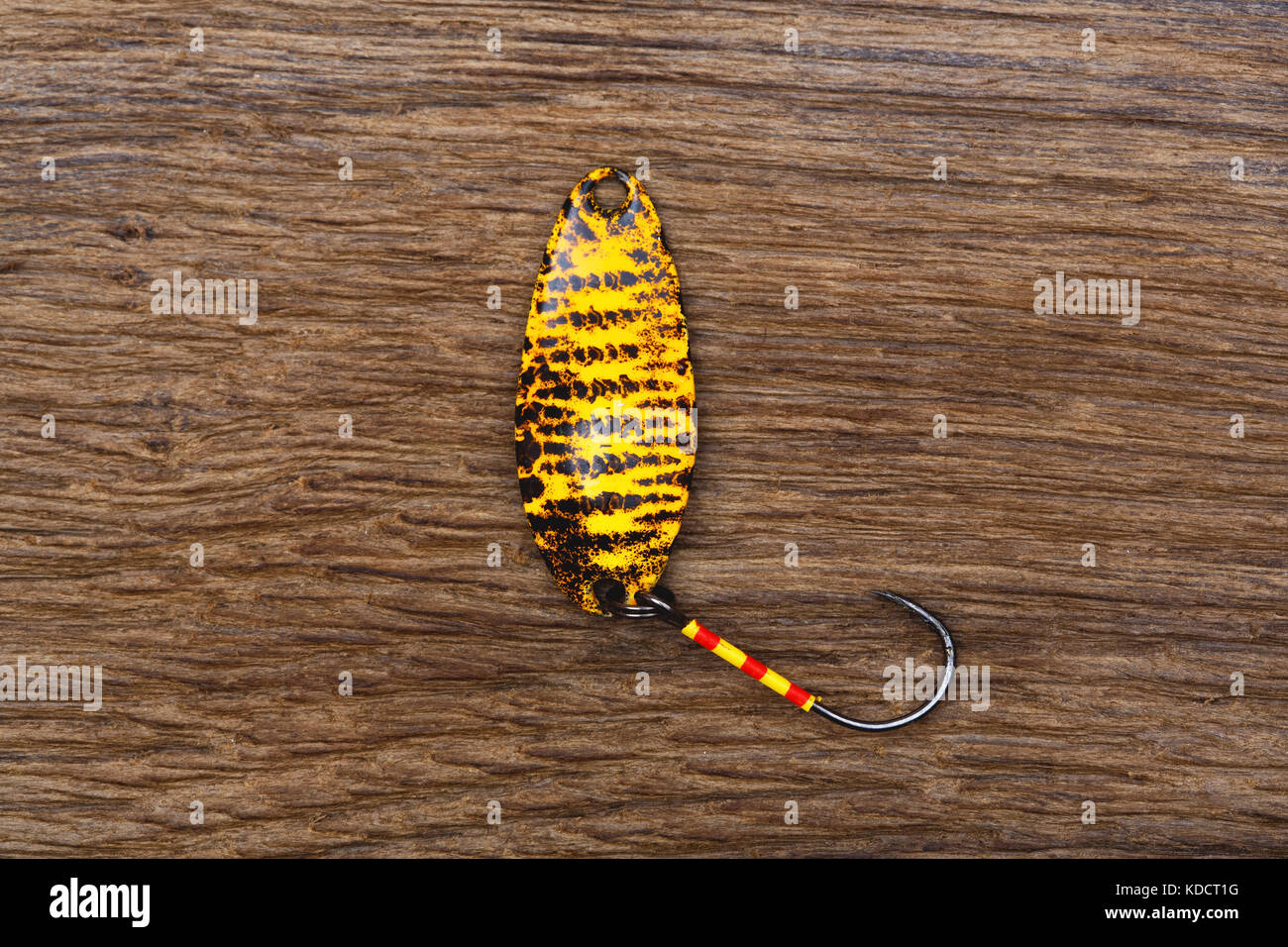Yellow bait for trout fishing on the old wooden table Stock Photo - Alamy