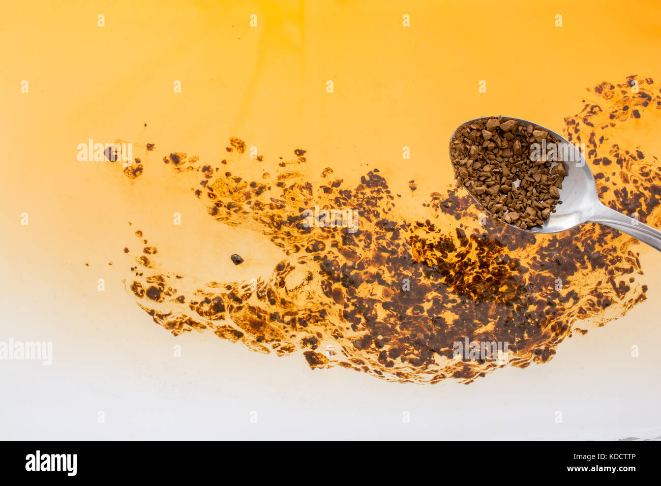 Coffe slowly dissolve in the hot water Stock Photo - Alamy