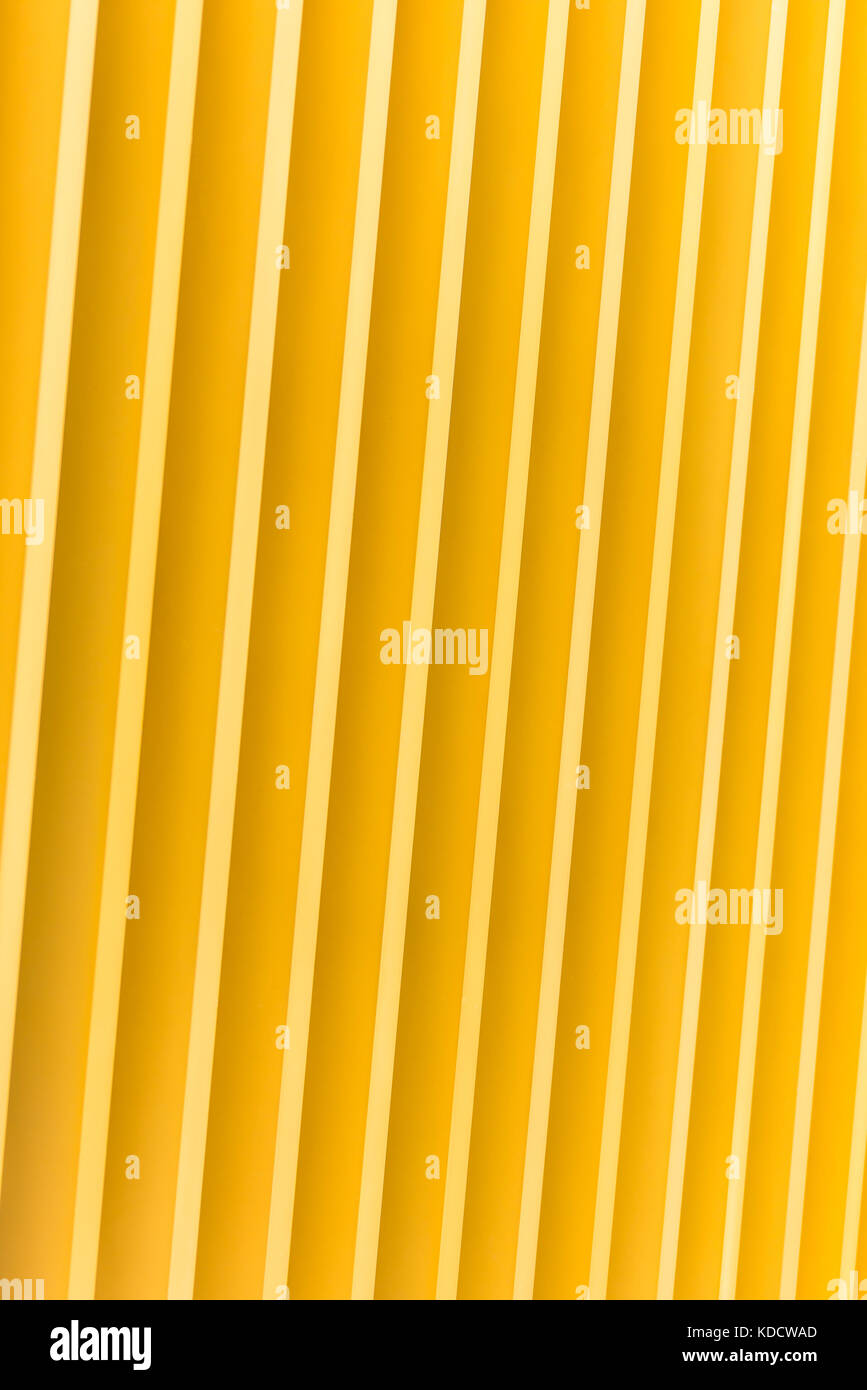 Detail of bright yellow metal building facade. For background Stock ...